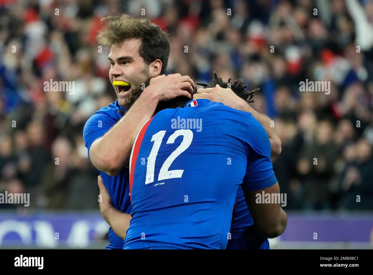 Damien Penaud celebrates after France's Antoine Dupont scored his side ...
