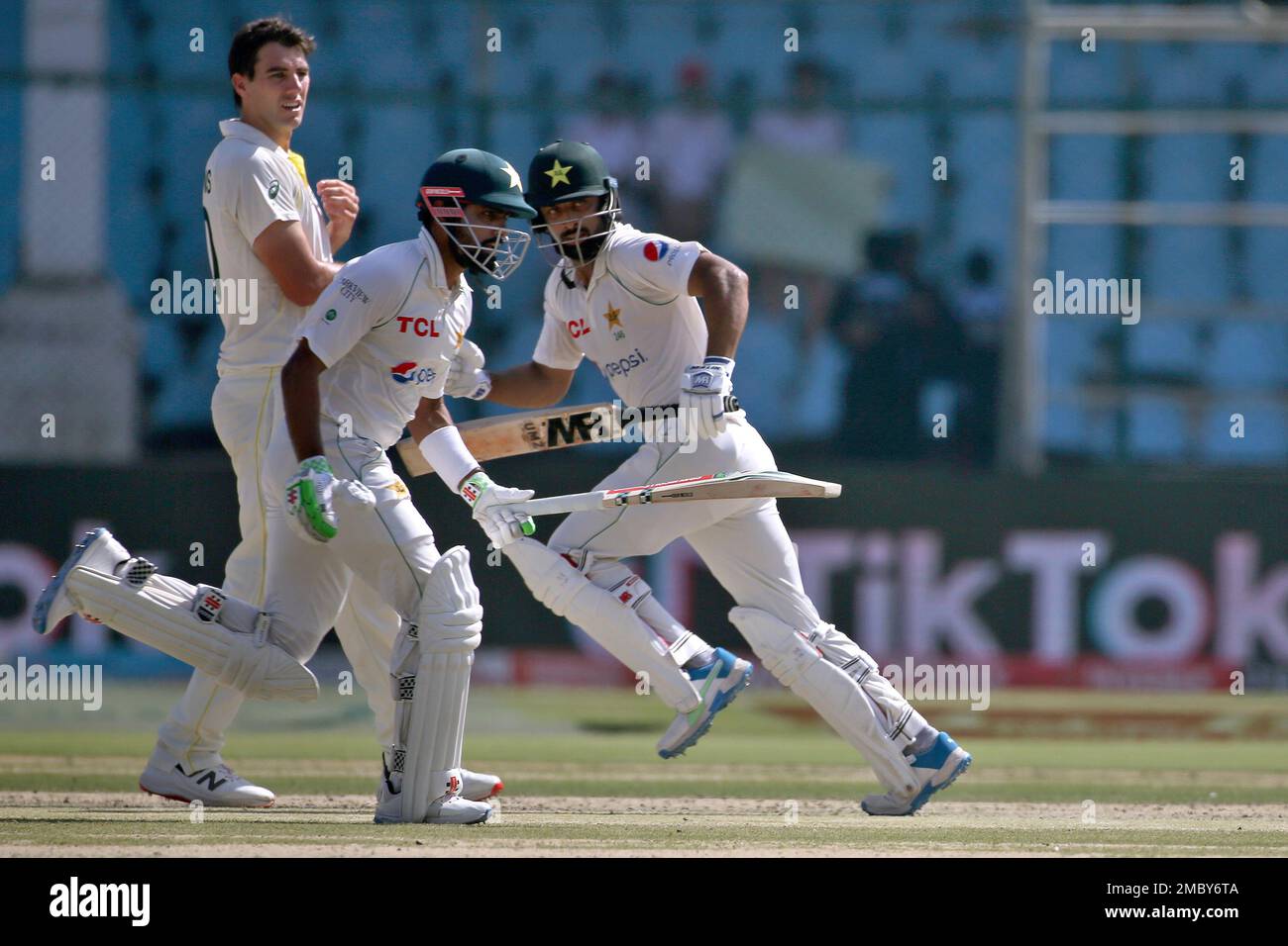 Pakistan's Abdullah Shafique, center, and Babar Azam, right, run ...