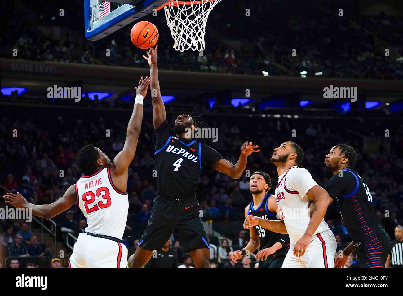 DePaul's Javon Freeman-Liberty (4) shoots over St. John's Montez Mathis ...