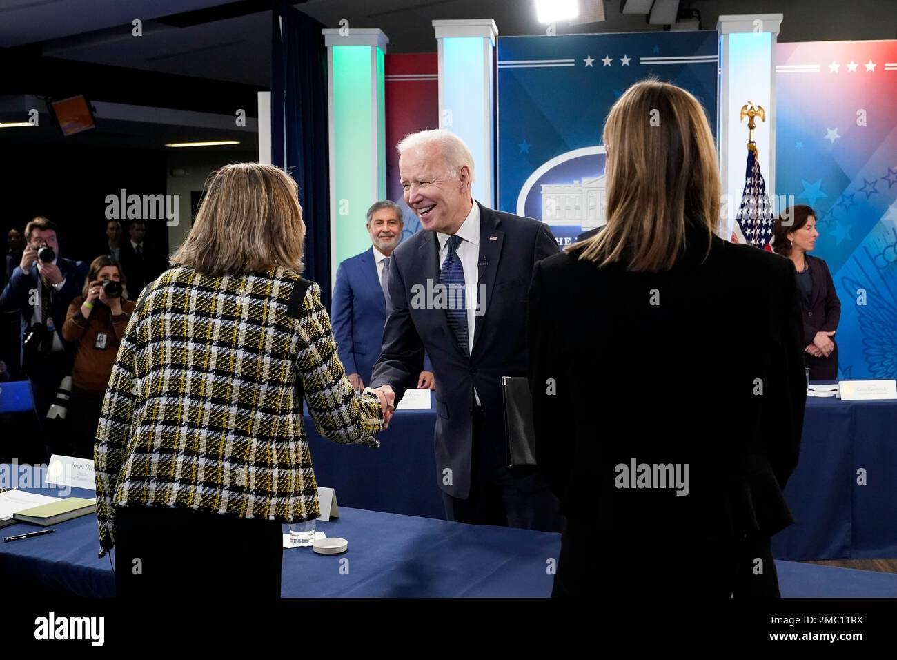 President Joe Biden greets Jennifer Rumsey, President and COO of ...