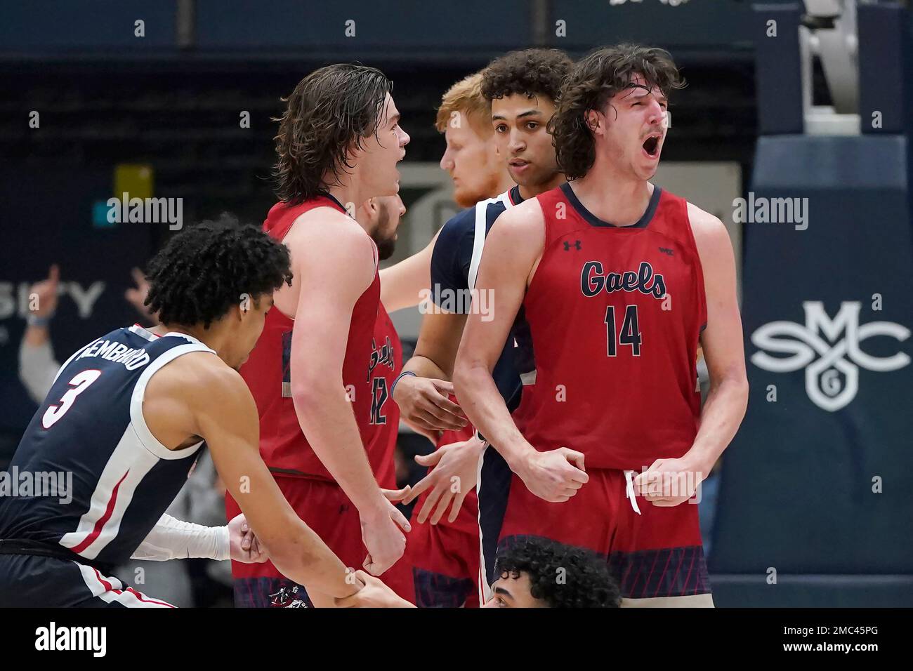 Saint Mary's guard Alex Ducas, back left, celebrates with forward Kyle ...