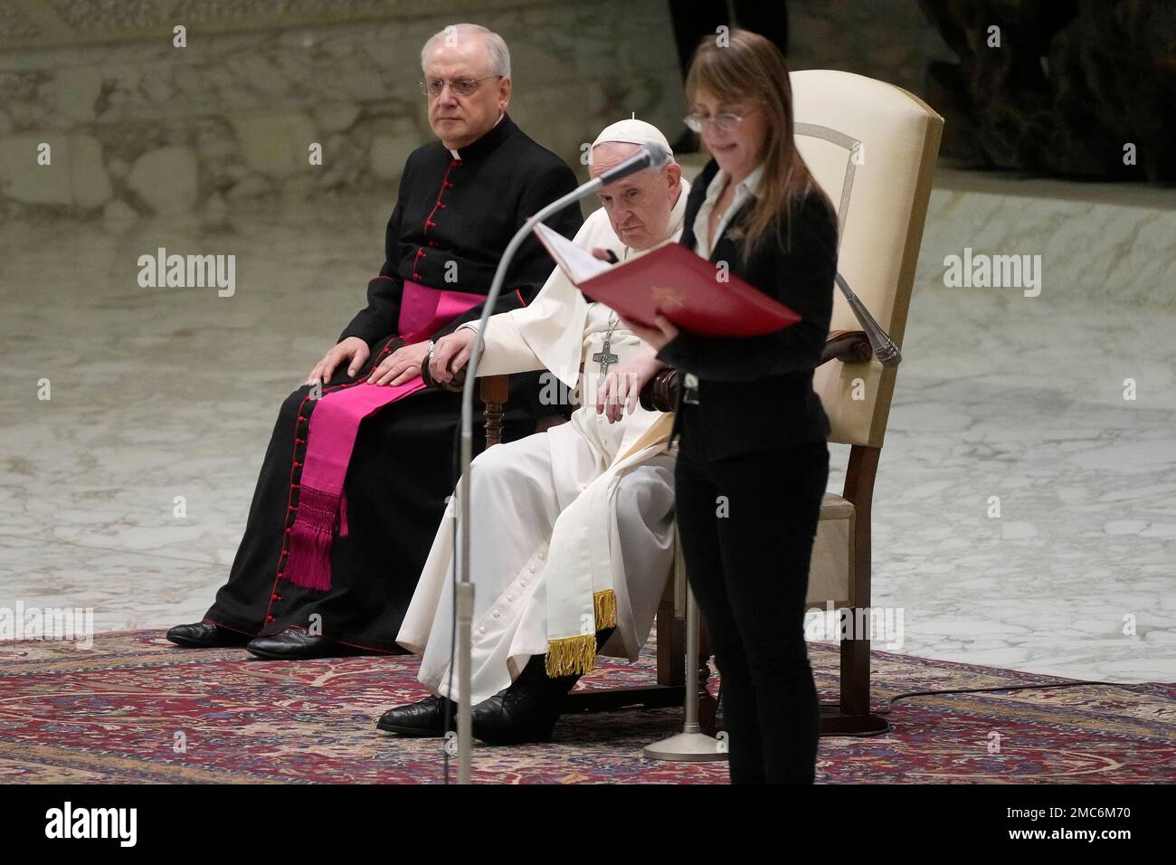 Pope Francis, center, sits next to Monsignor Leonardo Sapienza, left ...