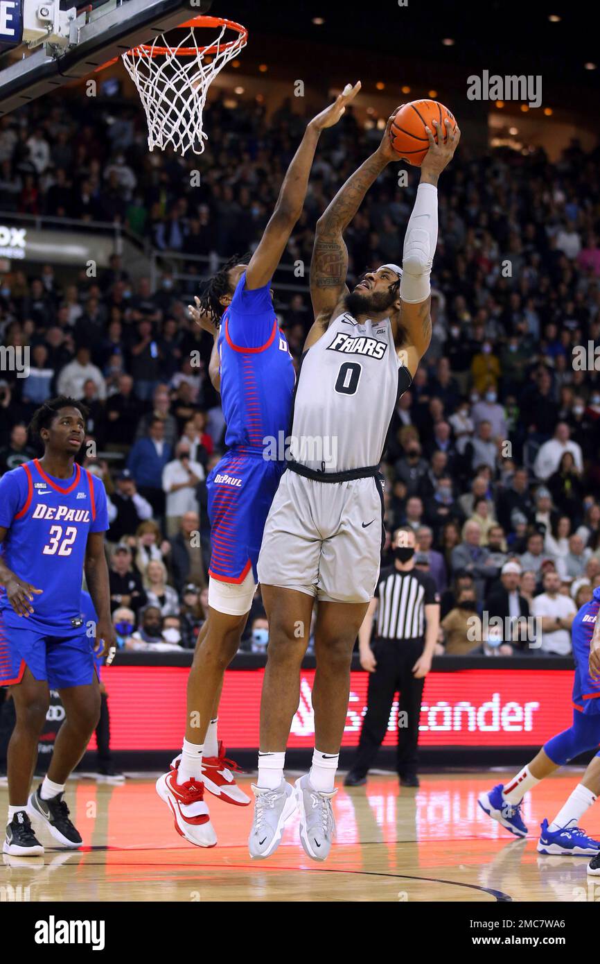 Providence's Nate Watson (0) shoots over DePaul's Nick Ongenda (14 ...