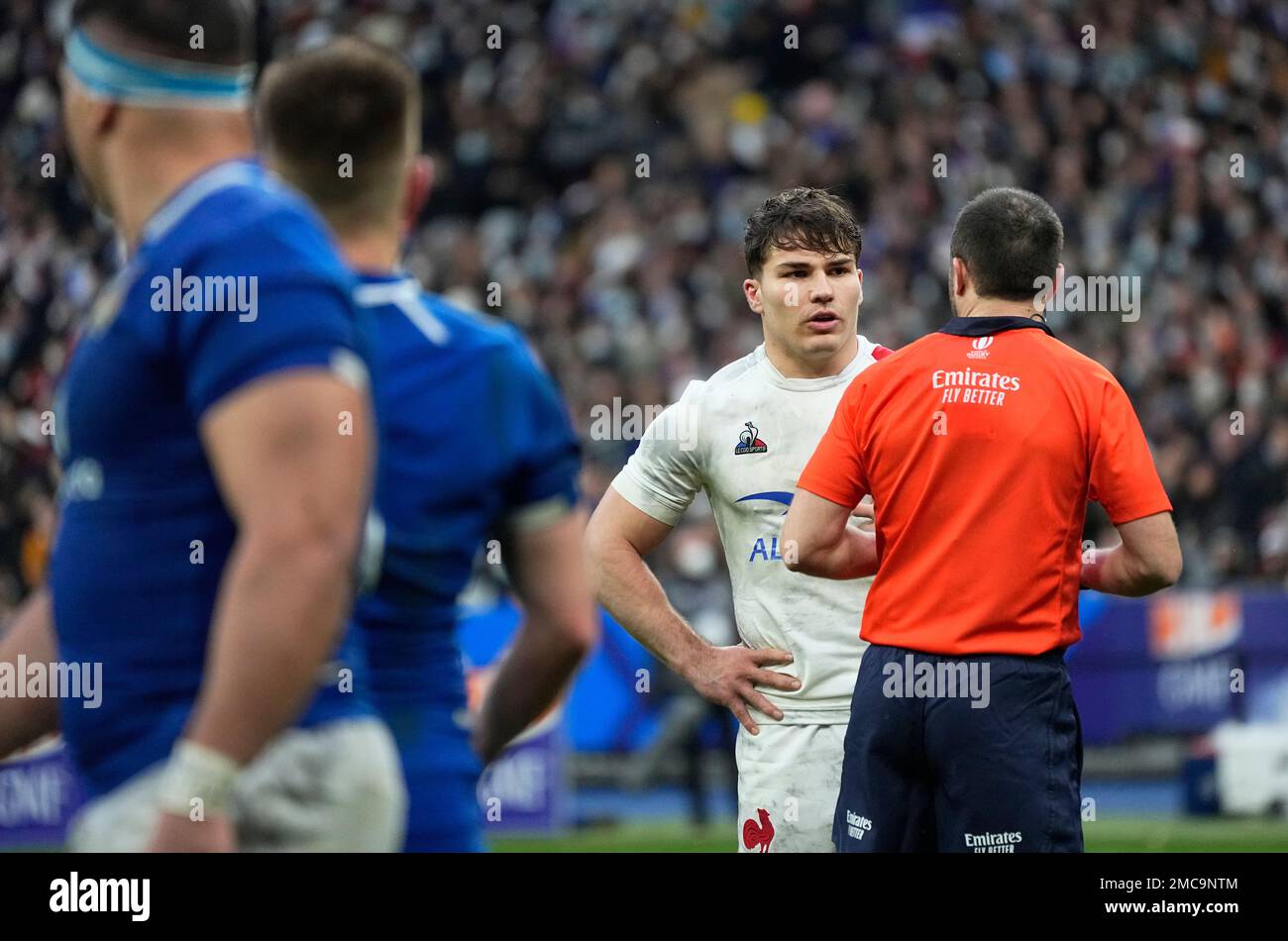 France's Antonie Dupont, second right, speaks with referee Mike Adamson ...