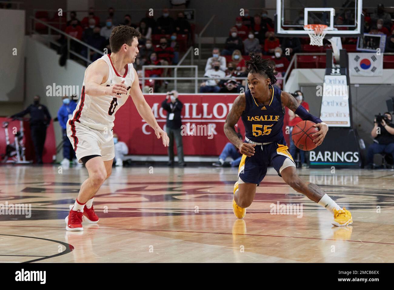 La Salle guard Khalil Brantley (55) is guarded by Davidson guard Foster ...