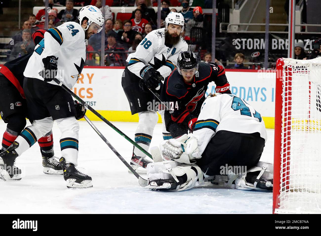 Carolina Hurricanes' Seth Jarvis (24) tries to jam the puck past San ...