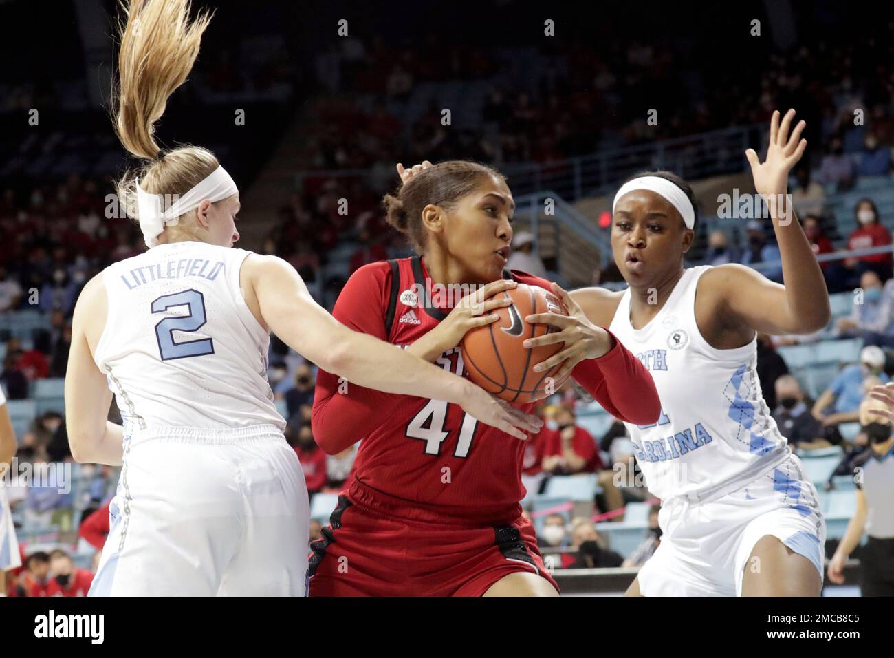 North Carolina State center Camille Hobby (41) drives between North ...