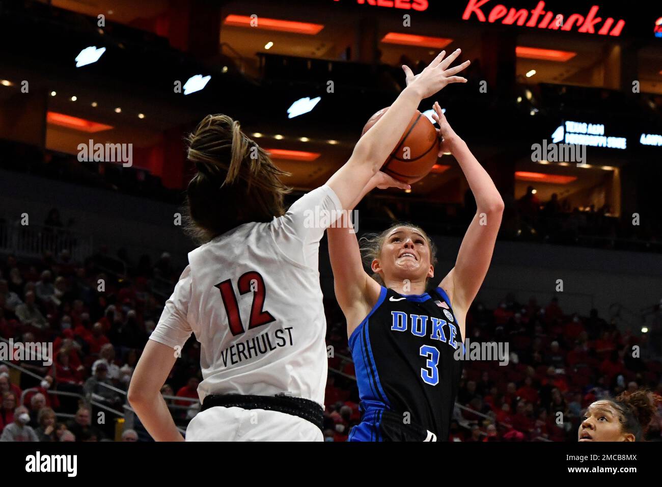 Duke guard Miela Goodchild (3) attempts to shoot over Louisville guard ...