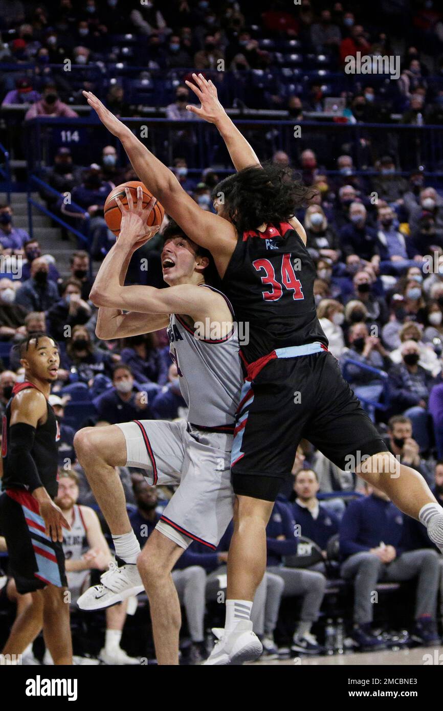 Gonzaga center Chet Holmgren, left, drives to the basket while ...