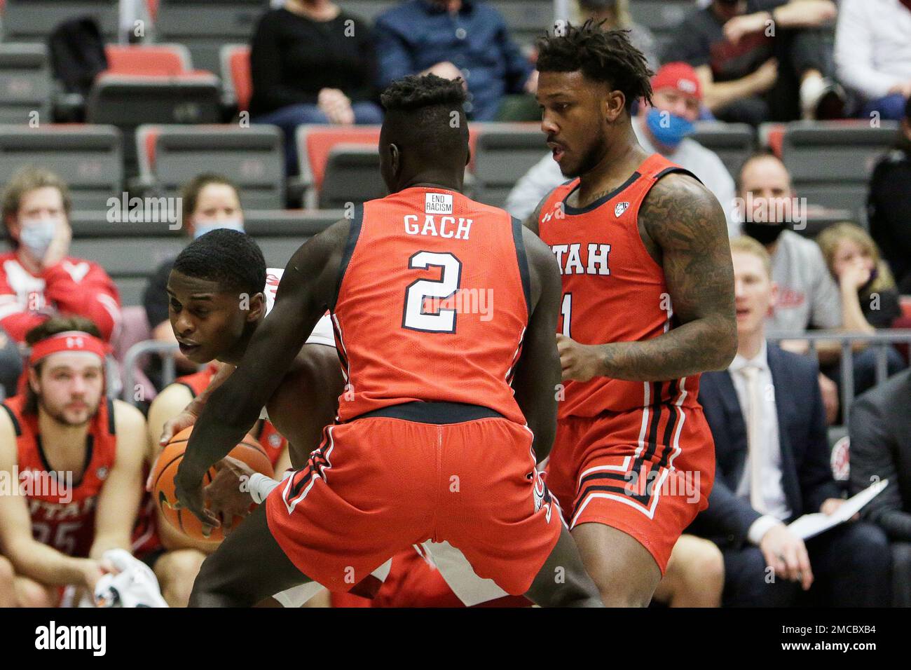 Utah guards David Jenkins Jr., right, and Both Gach, center, double ...