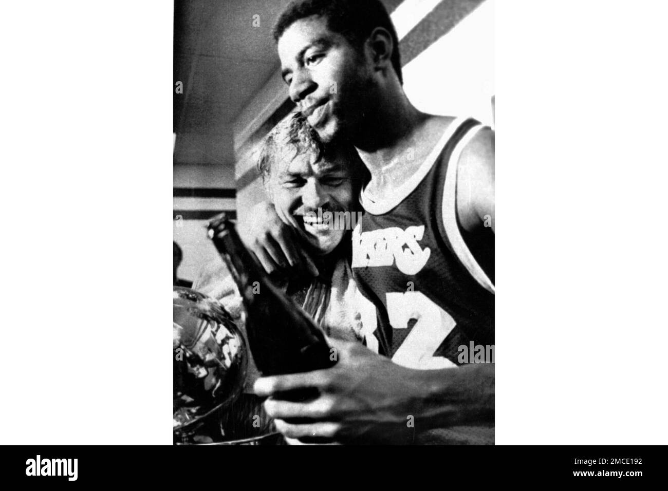 FILE - Los Angeles Lakers Earvin "Magic" Johnson hugs team owner Jerry ...