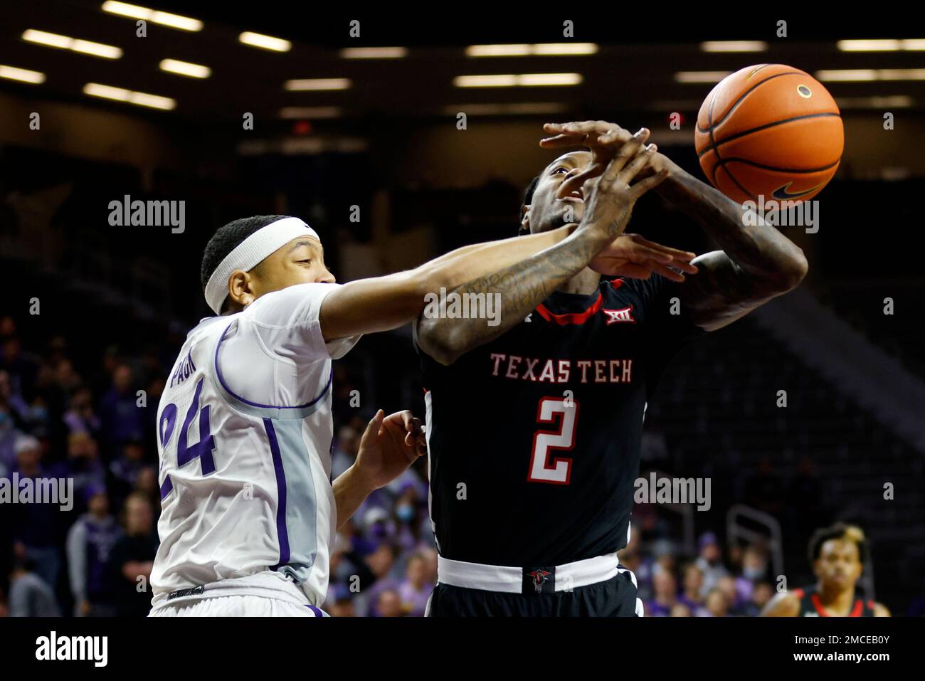 Kansas State guard Nijel Pack (24) fouls Texas Tech guard Davion Warren ...