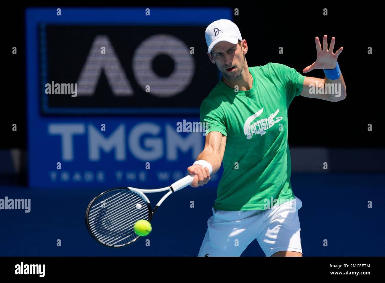 FILE - Defending men's champion Serbia's Novak Djokovic practices on ...