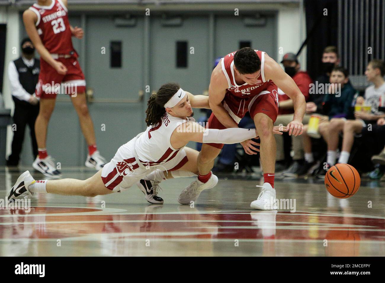 Washington State guard Tyrell Roberts, left, tries to get the ball from ...