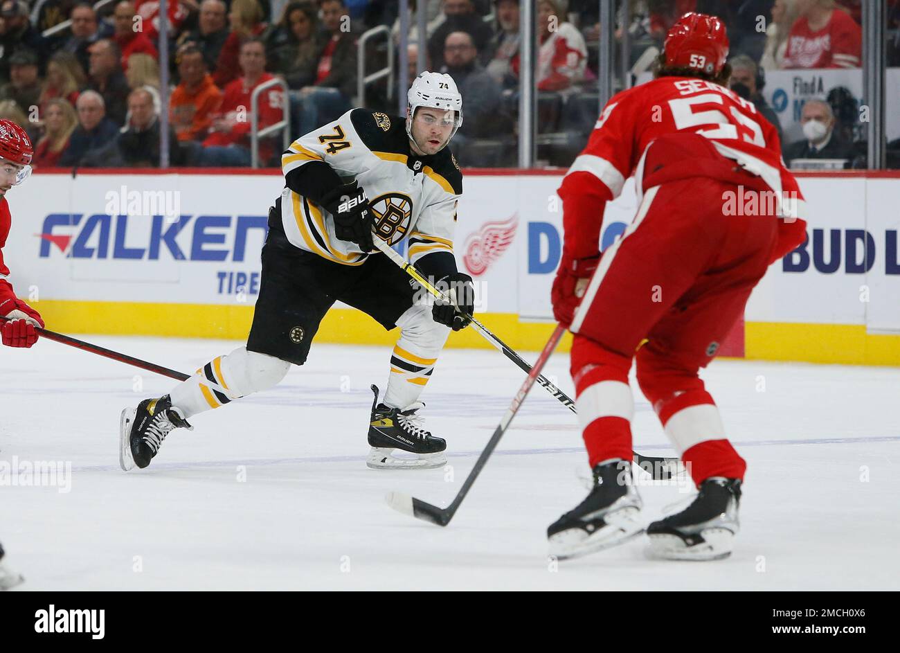 Boston Bruins left wing Jake DeBrusk (74) looks for a shot against ...