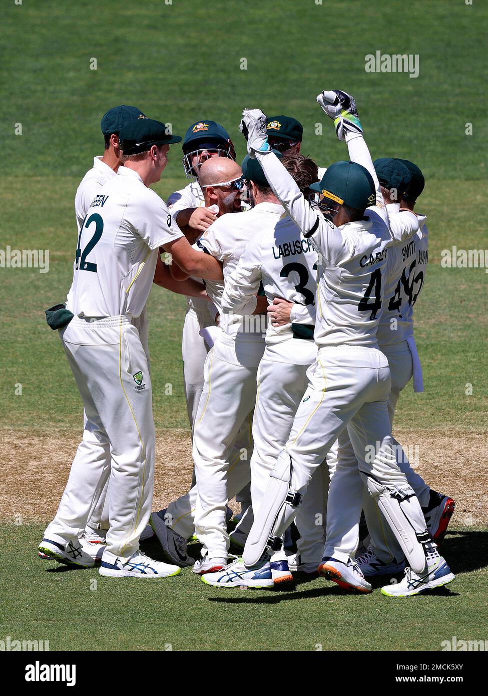 Australia's Nathan Lyon, fourth left, is congratulated by teammates ...
