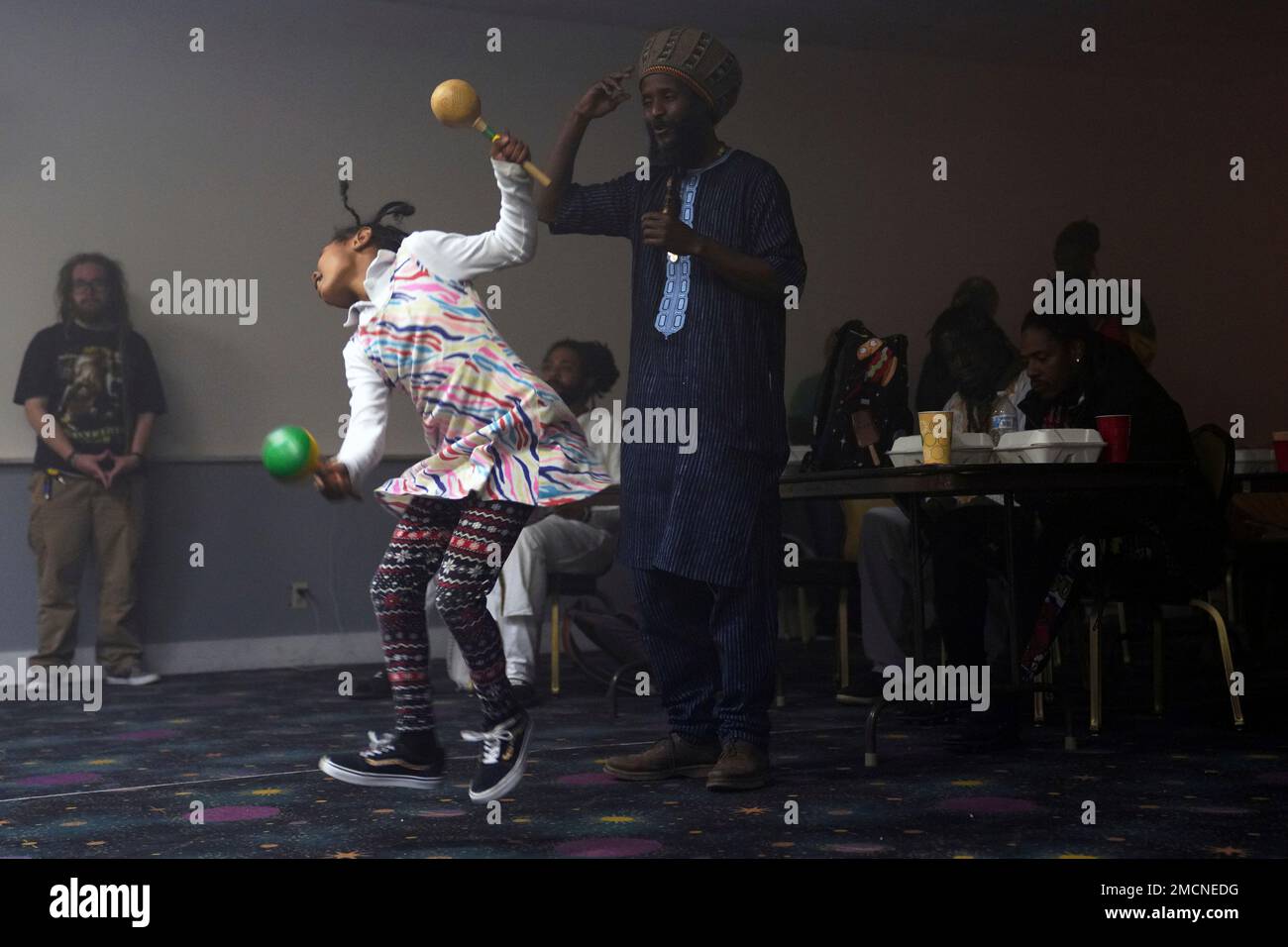 Empress Imani Tafari, 8, and Ras Mo dance during an event by the ...