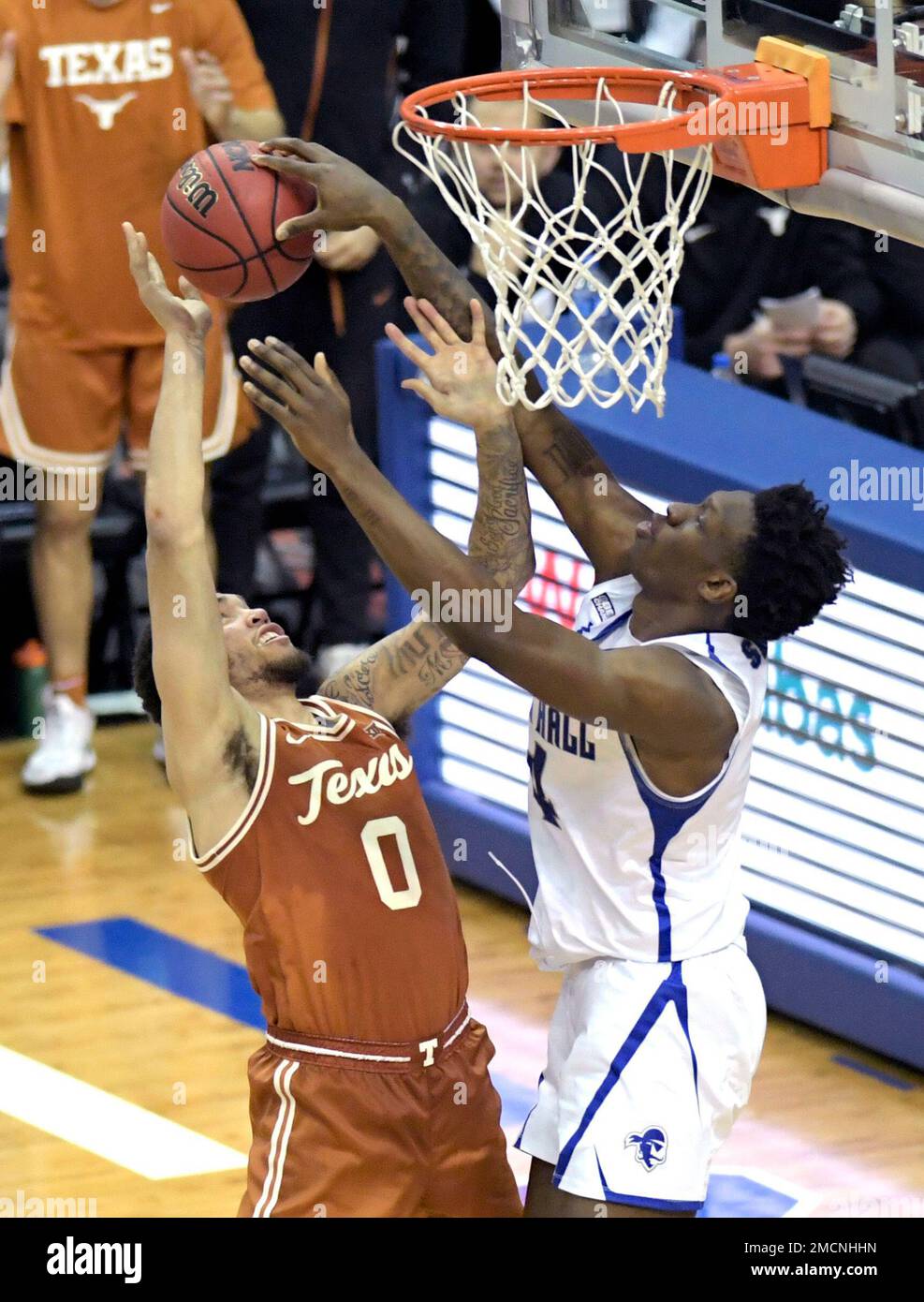 Seton Hall forward Tyrese Samuel (4) blocks a shot by Texas forward ...