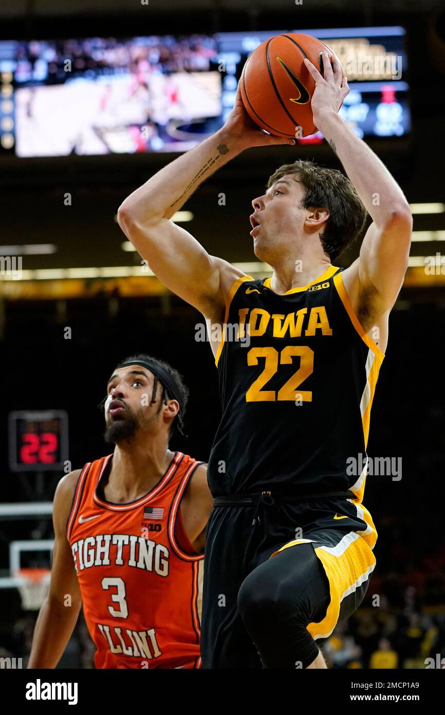 Iowa forward Patrick McCaffery (22) drives to the basket ahead of ...