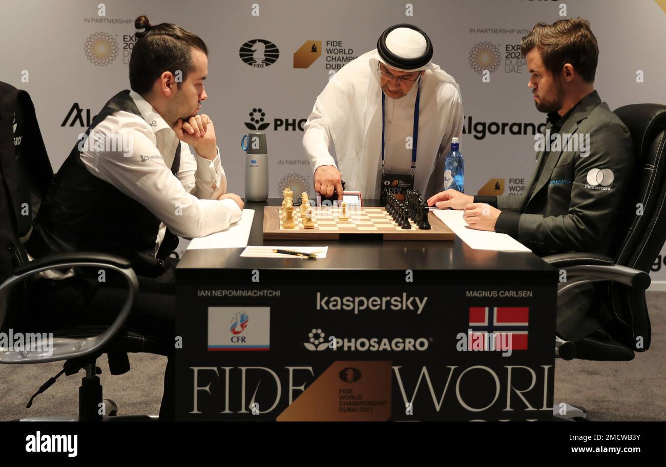 Norway's World Chess Champion Magnus Carlsen, right, and Ian Nepomniachtchi of Russia, start ...