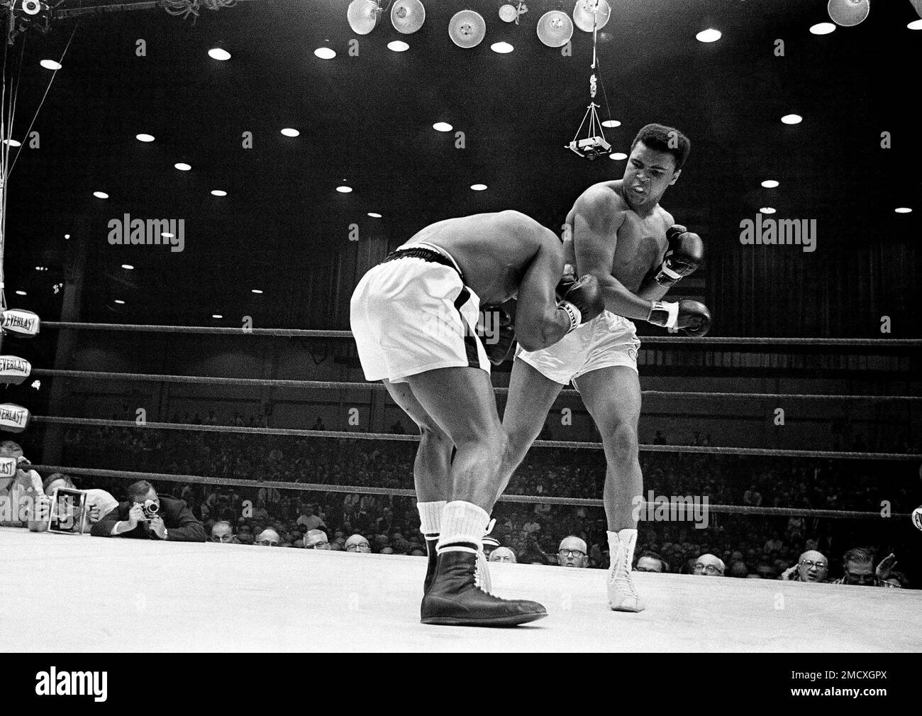 FILE - Muhammad Ali, or Cassius Clay as he was known at the time, whips ...