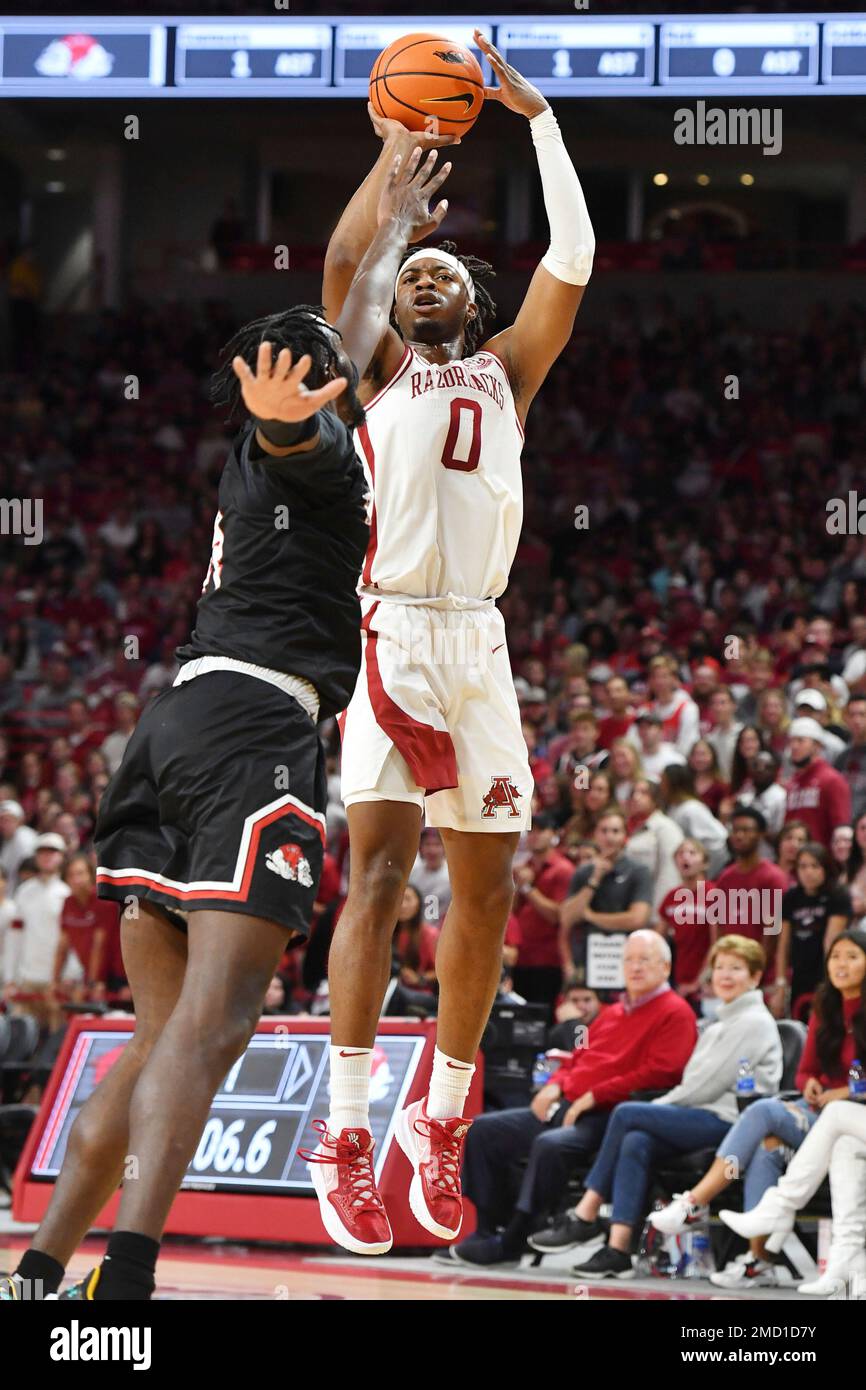 Arkansas guard Stanley Umude (0) shoots over Gardner-Webb forward ...