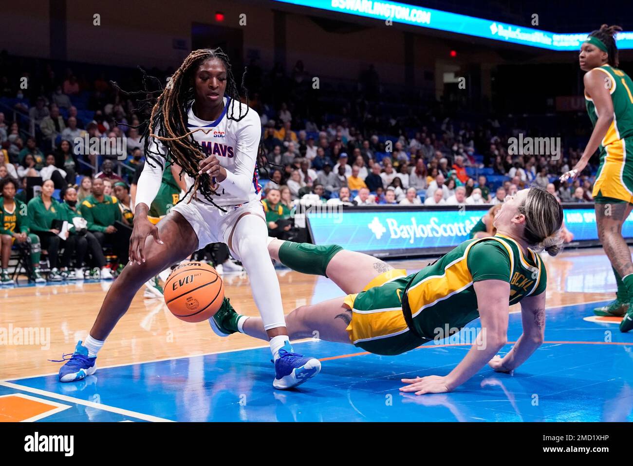 UT Arlington forward Starr Jacobs, left, loses control of the ball on a ...