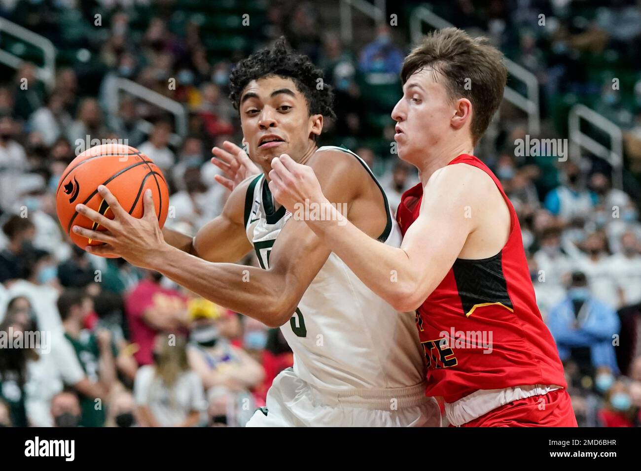 Michigan State guard Max Christie, left, is defended by Ferris State ...