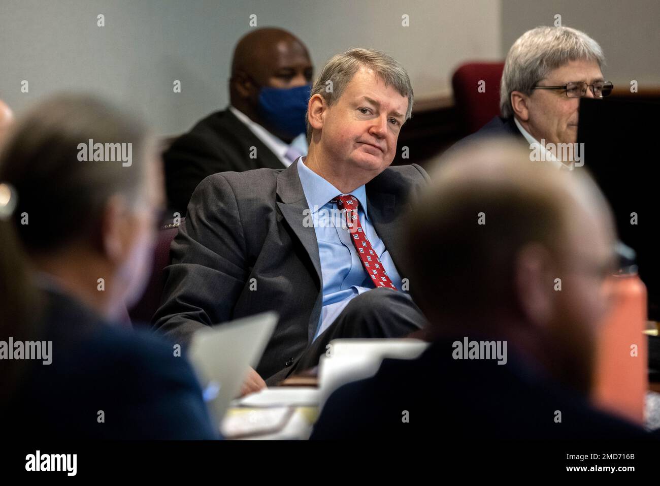 Defense attorney Kevin Gough, center, listens to questions during jury ...