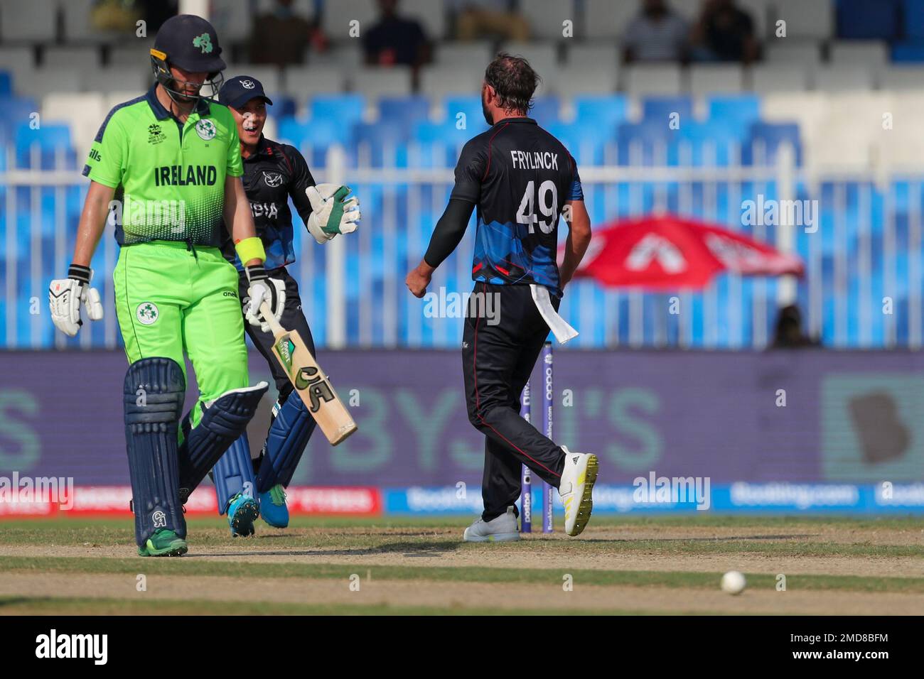 Ireland's captain Andrew Balbirnie, left, walks from the field after he ...