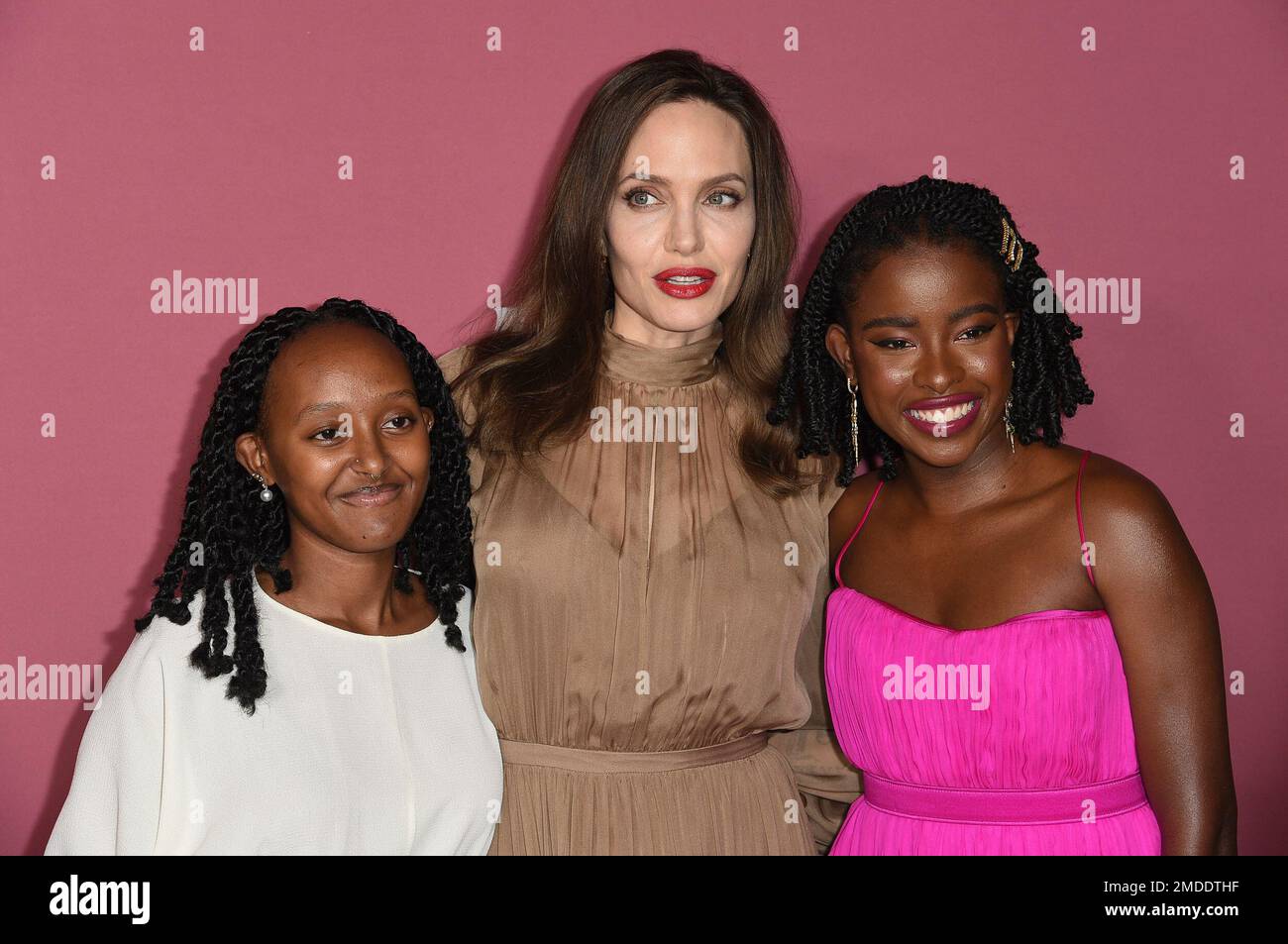 Zahara Jolie-Pitt, from left, Angelina Jolie and Amanda Gorman arrive ...