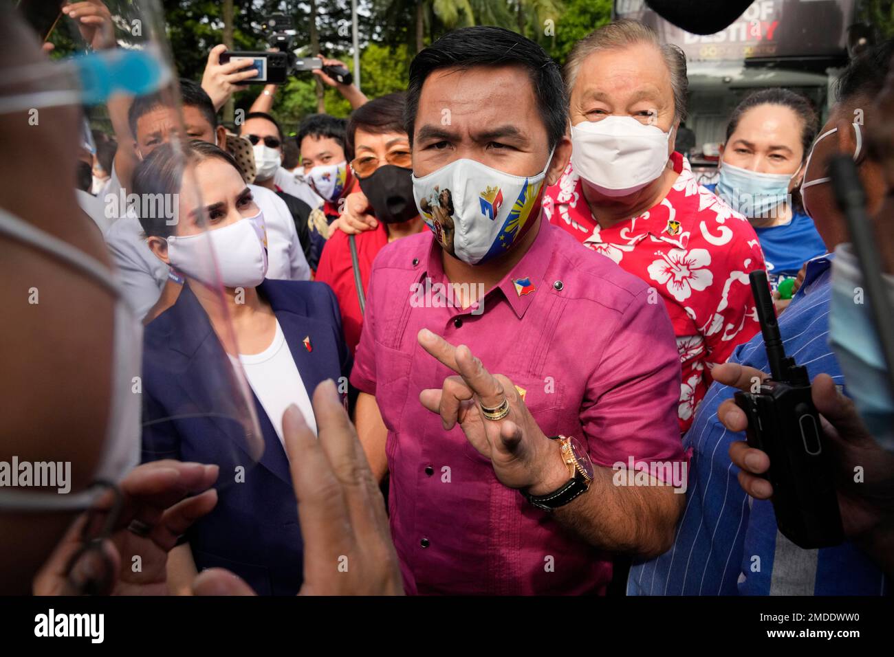 Retired Filipino boxing hero and senator Manny Pacquiao, center, talks ...