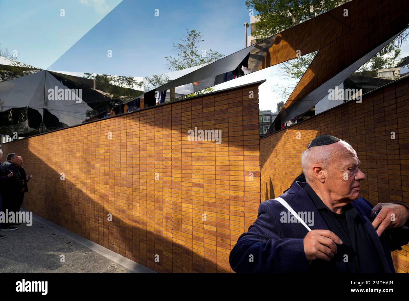 People walk alongs walls with name stones after King Willem-Alexander ...