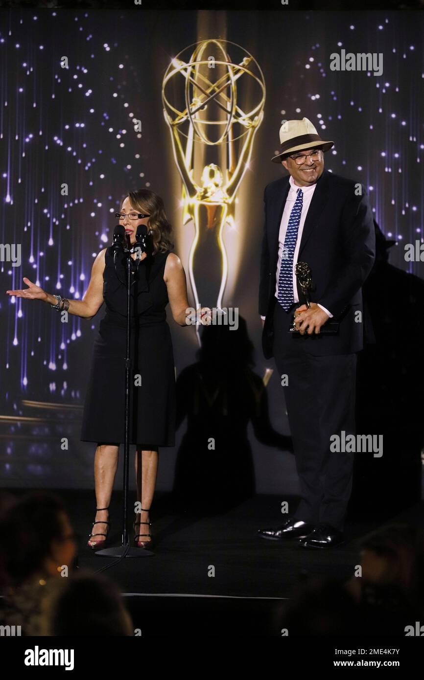 Norma Roque, left, and Andras Fernando Pruna accept the Art/Cultural ...