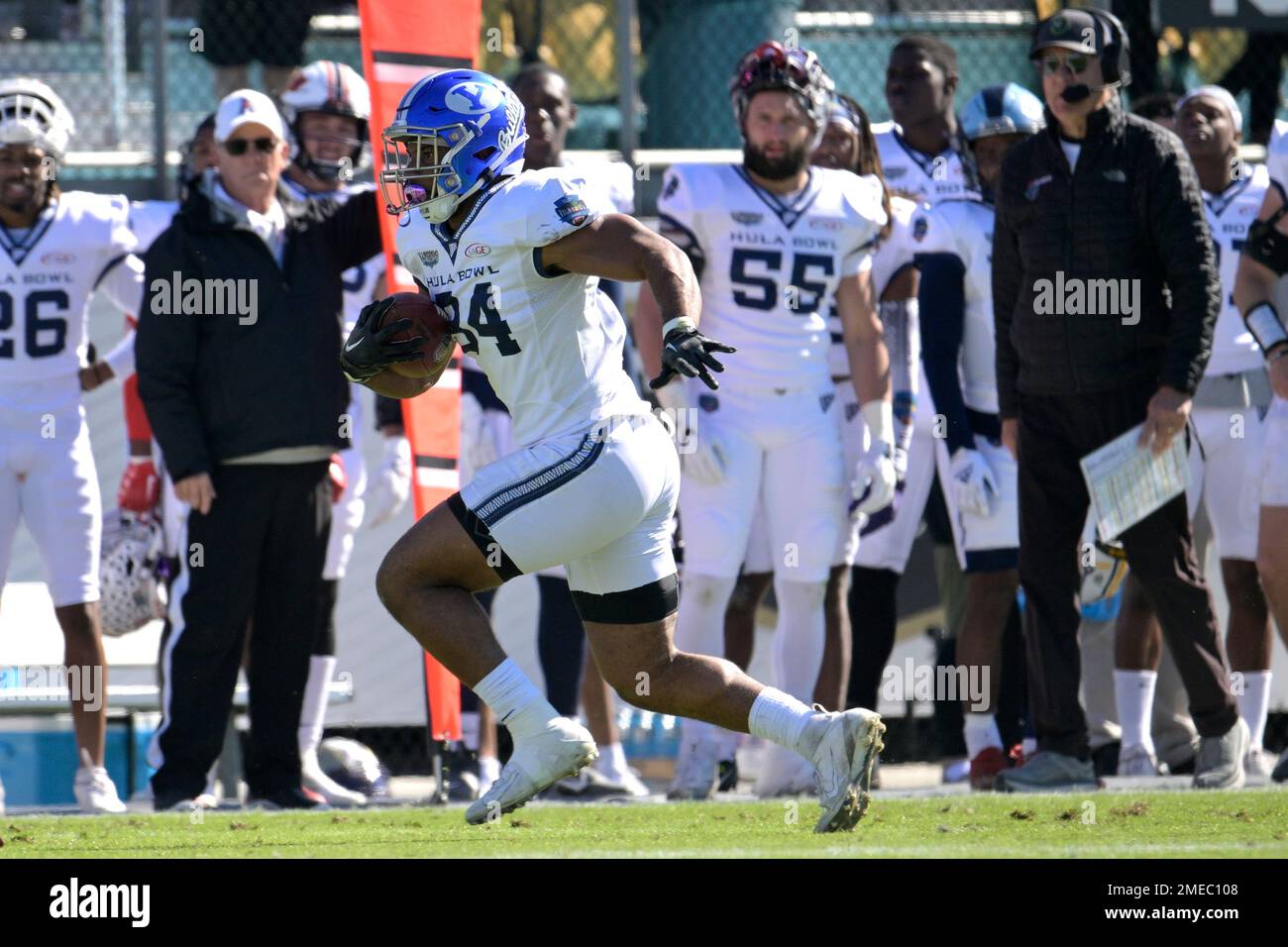 Team Kai running back Christopher Brooks (34), of BYU, runs after ...