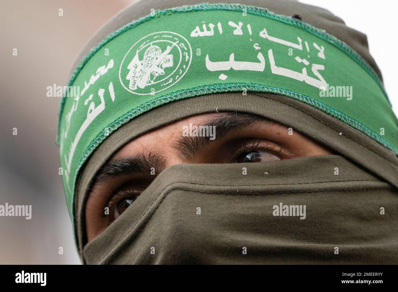 Hamas militants parade through the streets for Bassem Issa, a top Hamas ...