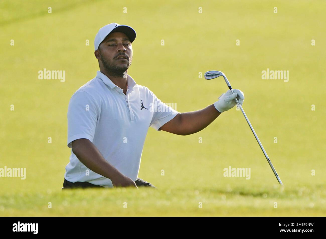 Harold Varner III looks to see where his chip shot landed on the 11th ...