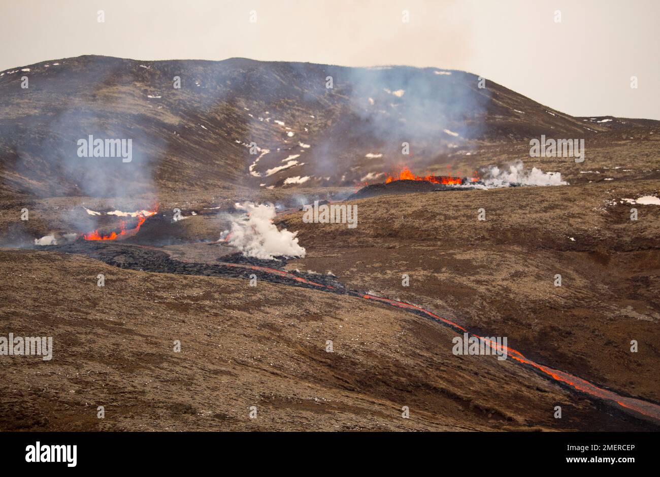 Steam and lava spurt from a new fissure on a volcano on the Reykjanes ...
