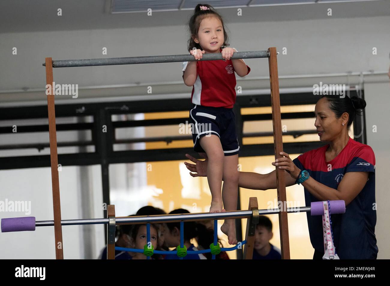 Rylae-Ann Poulin attends physical education class at Ruamrudee ...