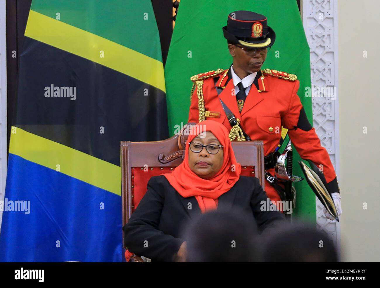 Tanzania's new president Samia Suluhu Hassan, center, is sworn in at a ceremony at State House ...