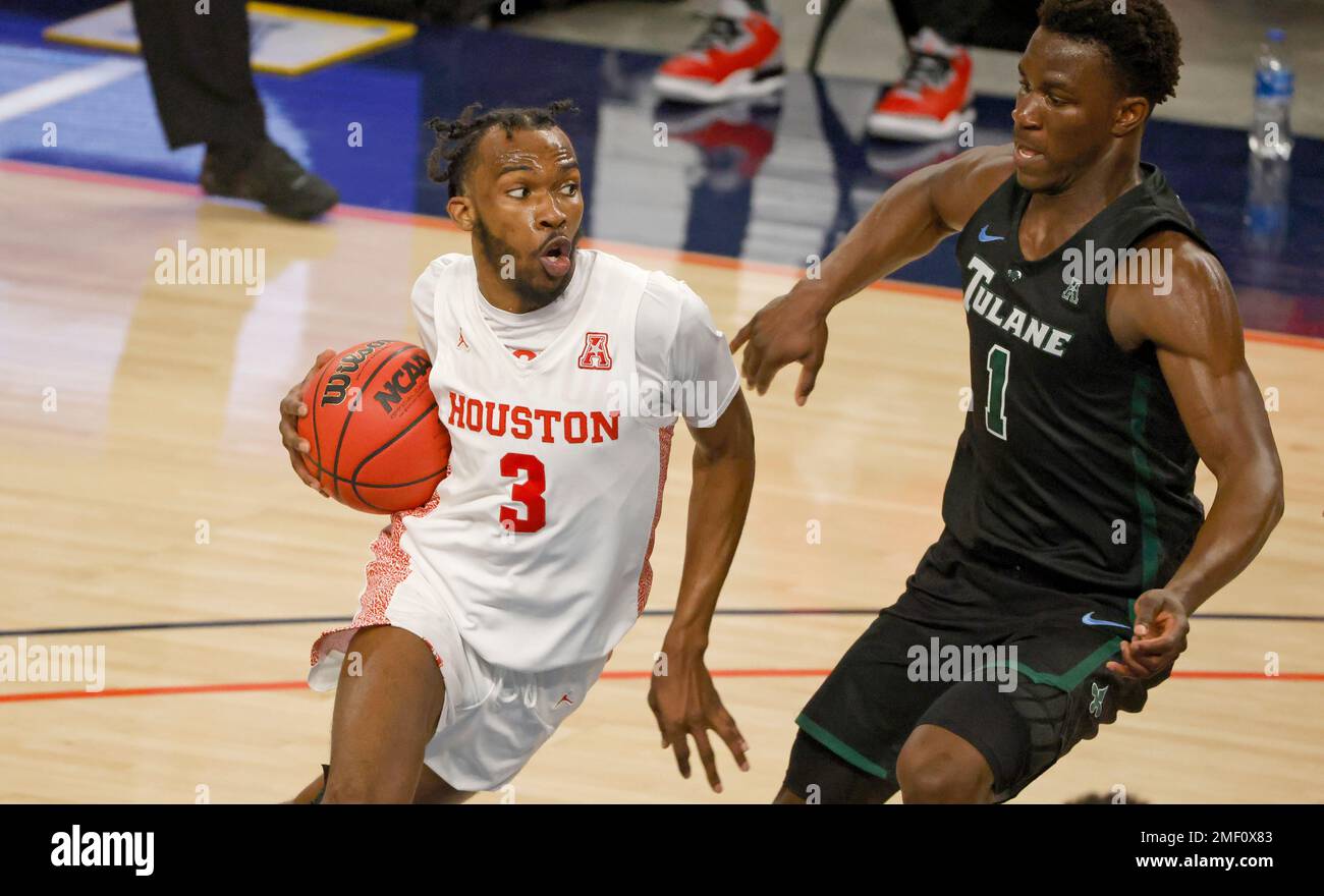 Houston guard DeJon Jarreau (3) drives past Tulane guard Sion James (1 ...