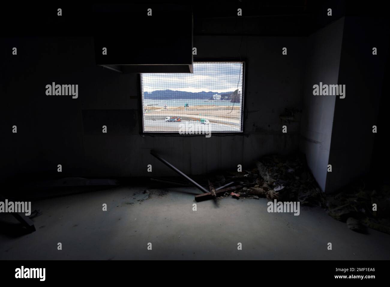 A broken window of a former wedding ceremony hall "Takano Kaikan ...