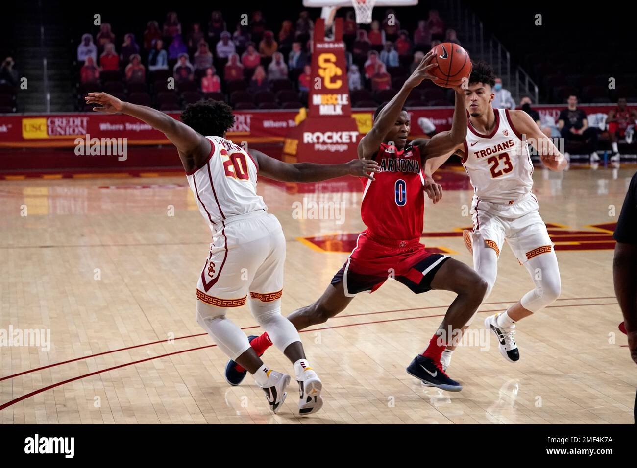 Arizona guard Bennedict Mathurin (0) dribbles between Southern ...