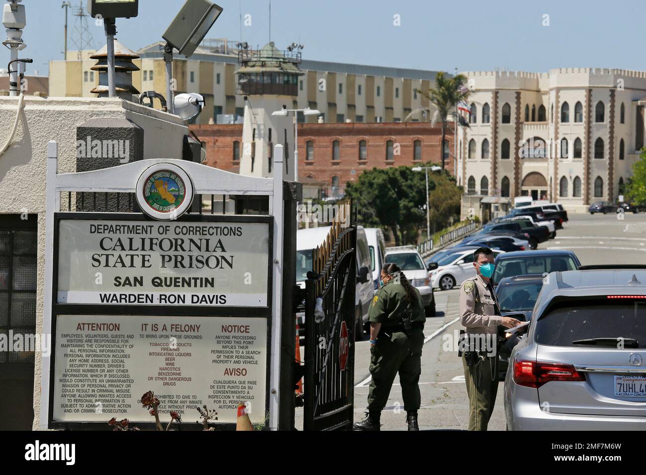FILE - In this July 9, 2020, file photo, a correctional officer checks ...