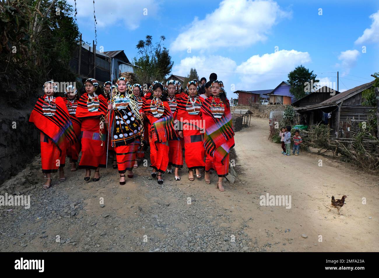 A group of Naga girls in traditional attire accompany a bride-to-be ...