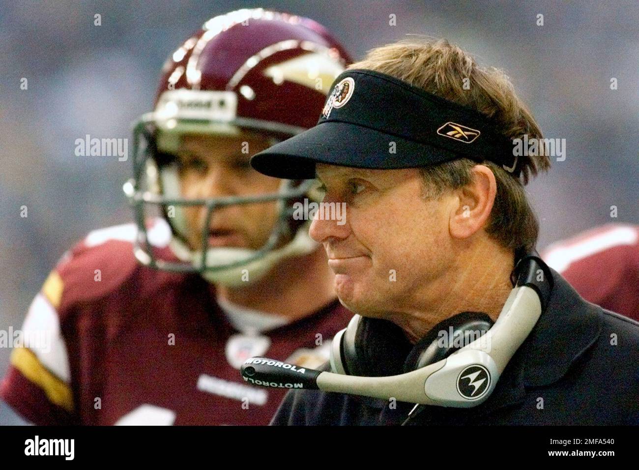 FILE - Washington Redskins coach Steve Spurrier, right, looks out at ...