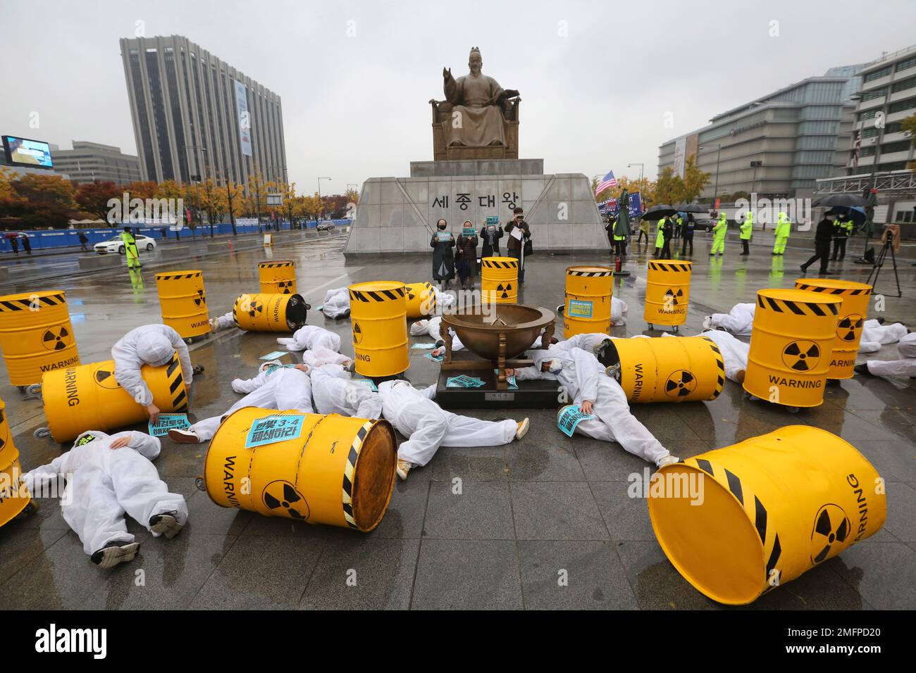 Protesters against nuclear power plants with mock nuclear waste drum ...