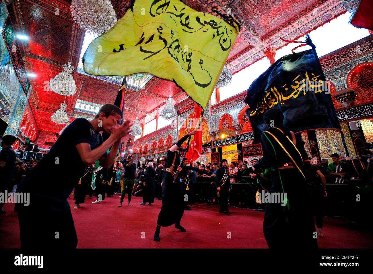 Shiite worshippers gather inside the holy shrine of Imam Abbas ahead of ...