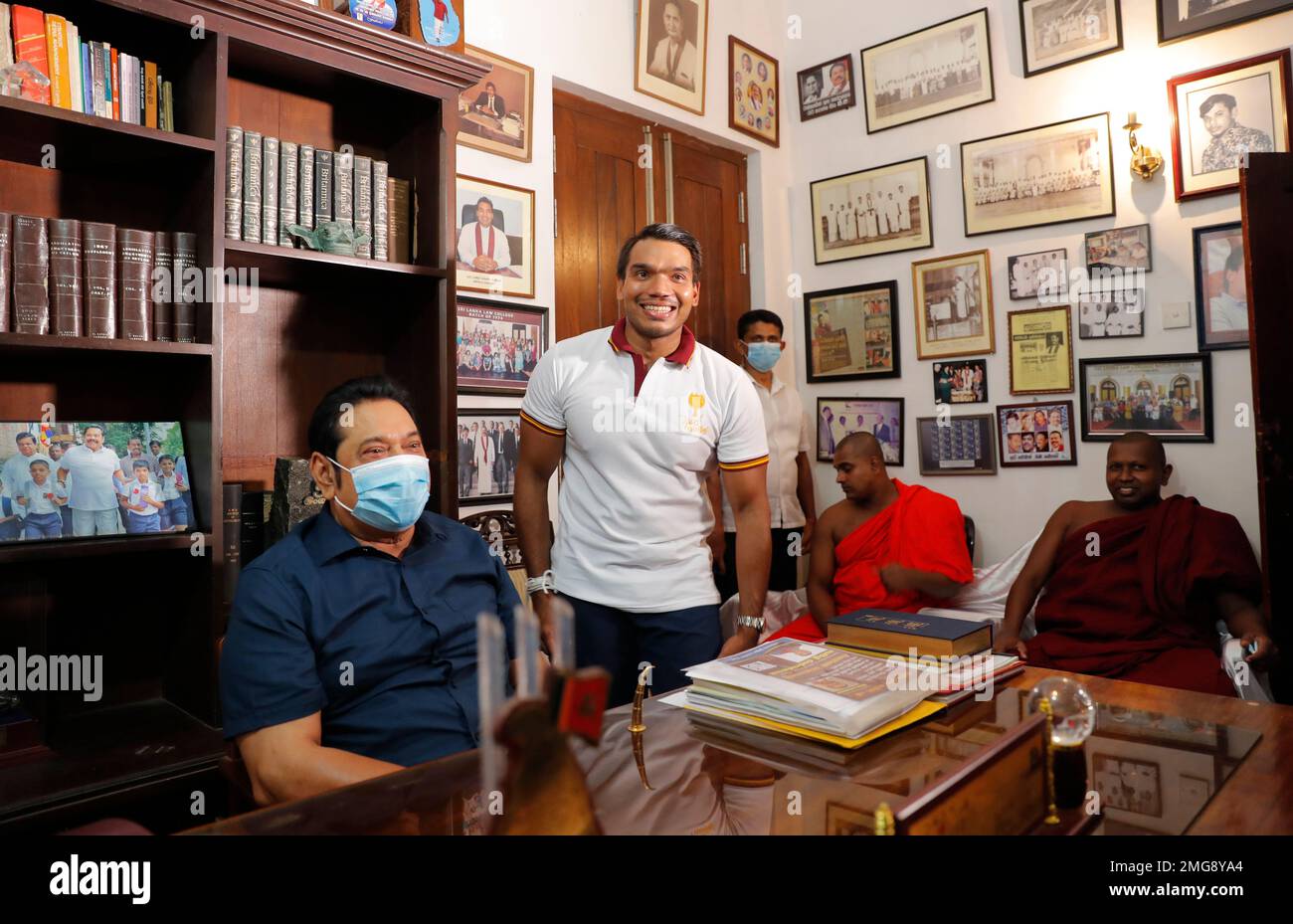 Sri Lankan Prime Minister Mahinda Rajapaksa sits for photographs with ...