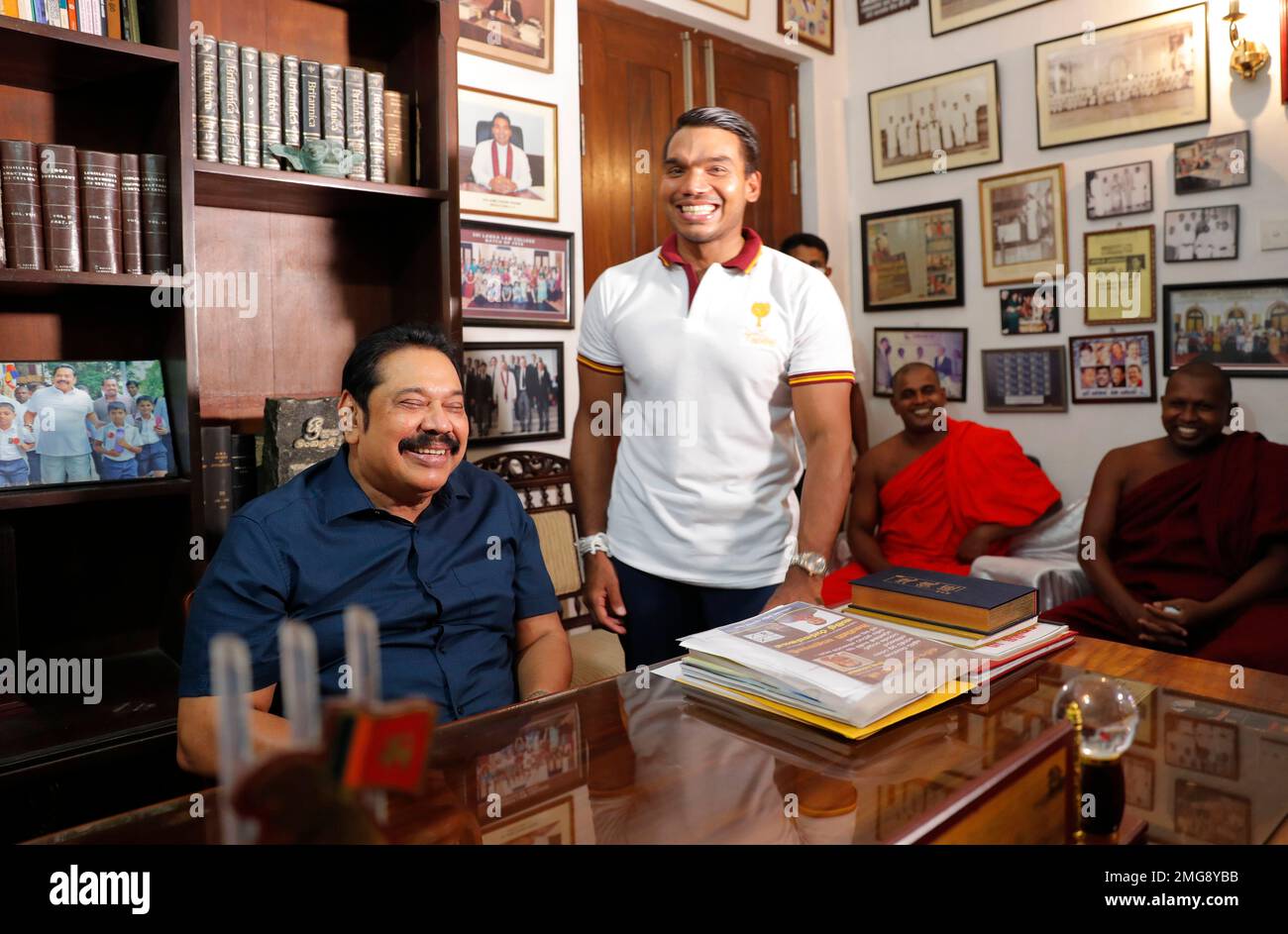 Sri Lankan Prime Minister Mahinda Rajapaksa sits for photographs, with ...
